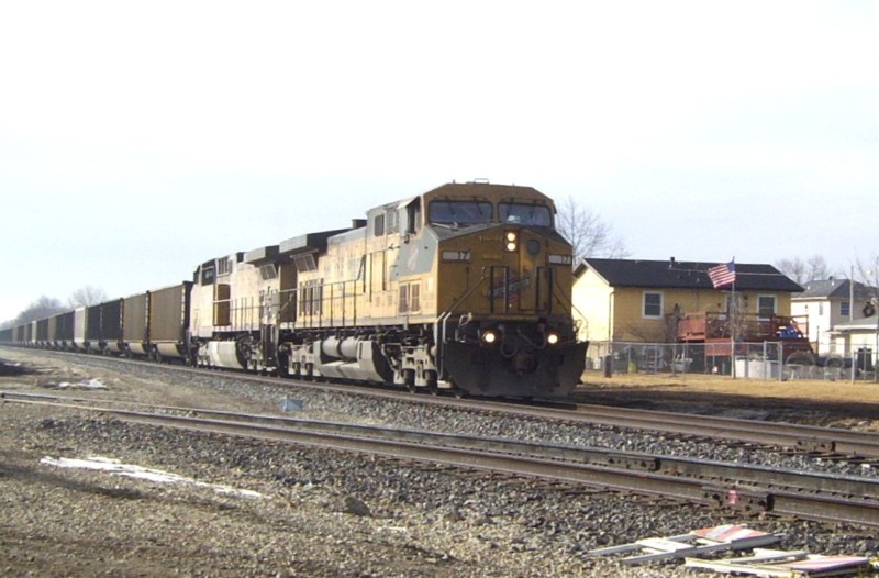 CNW 8817 leads a laod of empty hoppers on the E.J.& E.